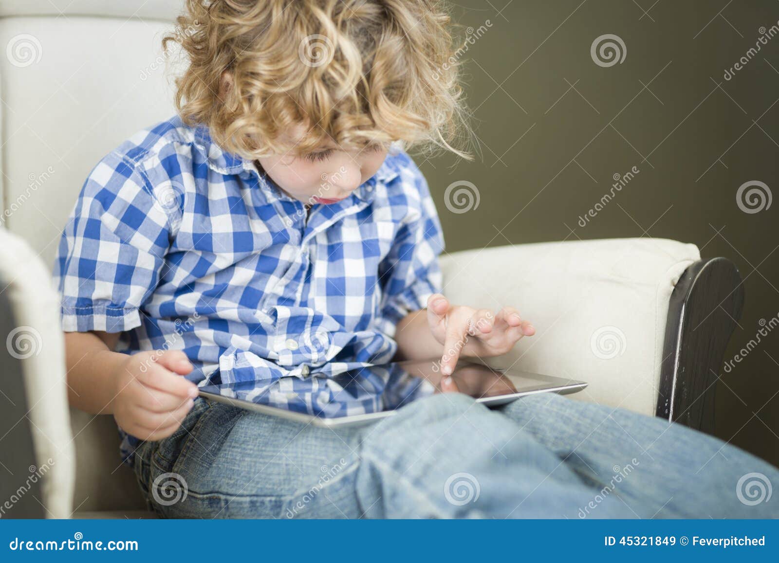 Young Blond Boy Using His Computer Tablet Stock Image - Image of ...