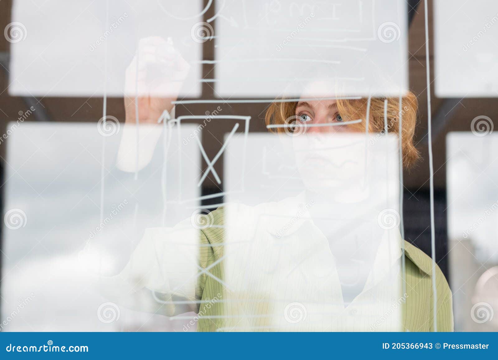 Young Blond Female Software Developer Concentrating on Work Over New ...