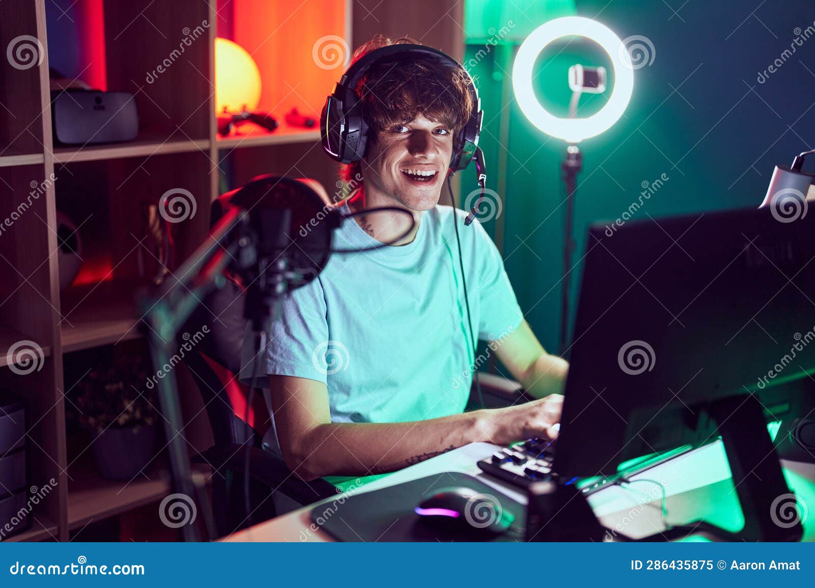 Young Blond Man Playing Video Game Using Computer at Gaming Room Stock ...