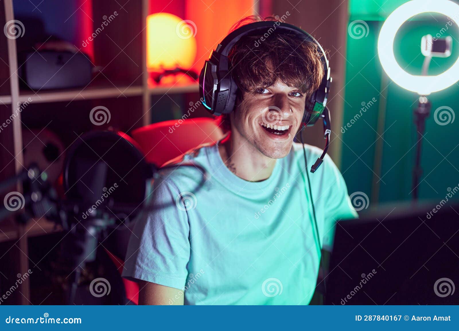 Young Blond Man Playing Video Game Using Computer at Gaming Room Stock ...