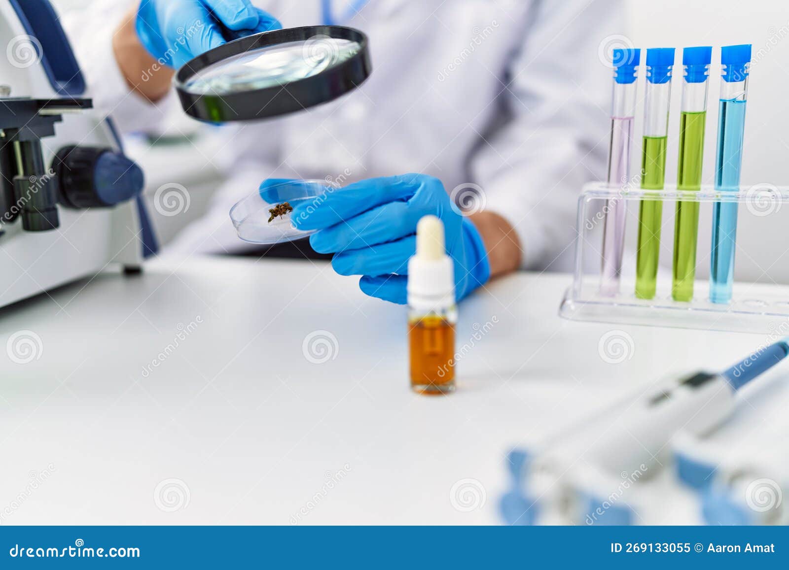 Young Blond Man Scientist Using Magnifying Glass at Laboratory Stock ...