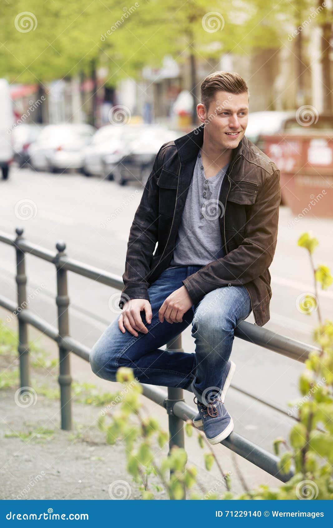 Young Blond Man Sitting Outside Stock Photo - Image of jacket, people ...