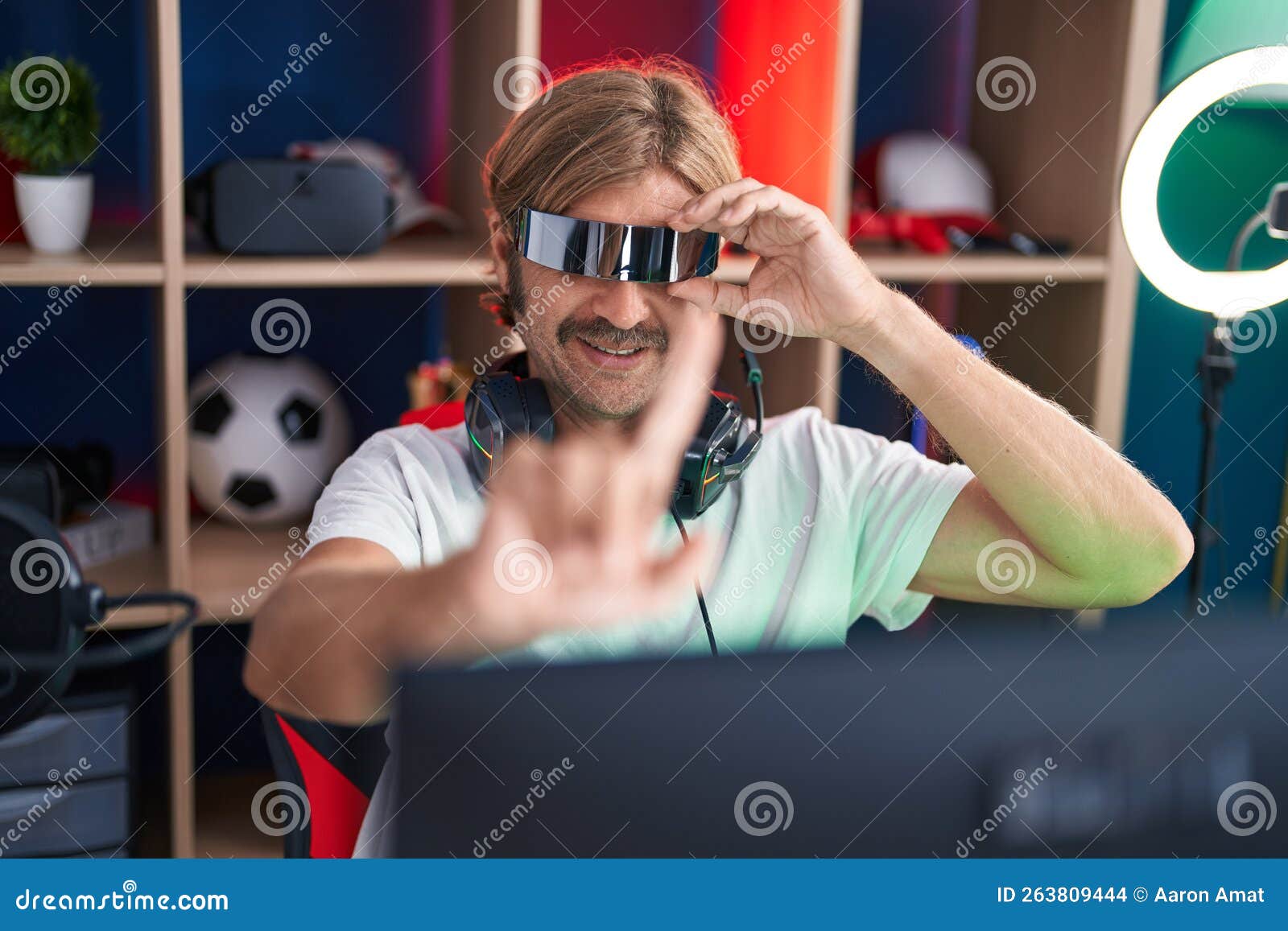 Young Blond Man Streamer Playing Video Game Using Virtual Reality ...