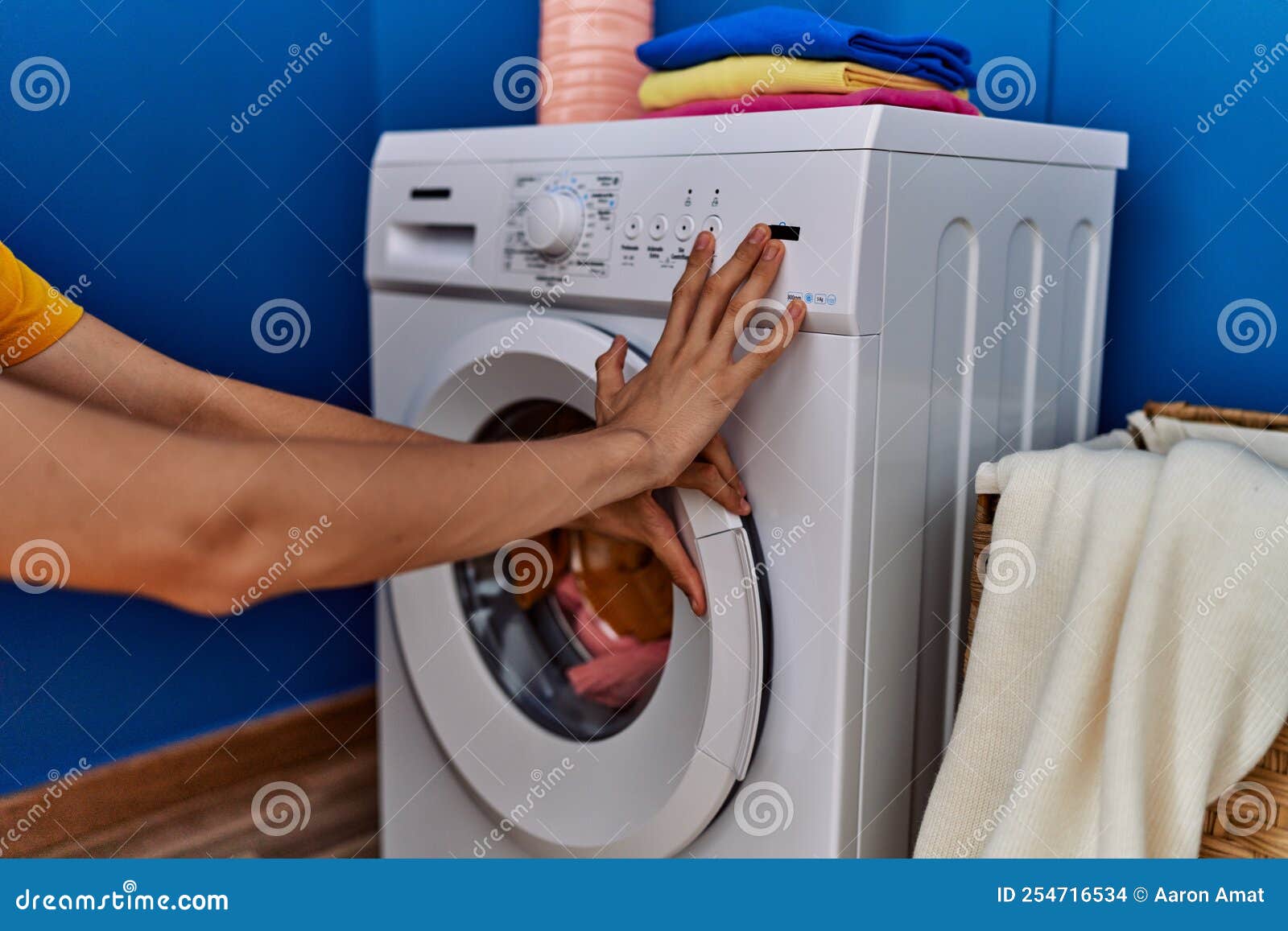 Young Blond Man Turning on Washing Machine at Laundry Room Stock Photo ...