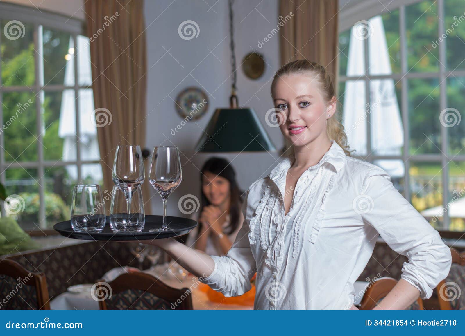 Young Blond Waitress in a Restaurant Stock Photo - Image of blondhaired ...
