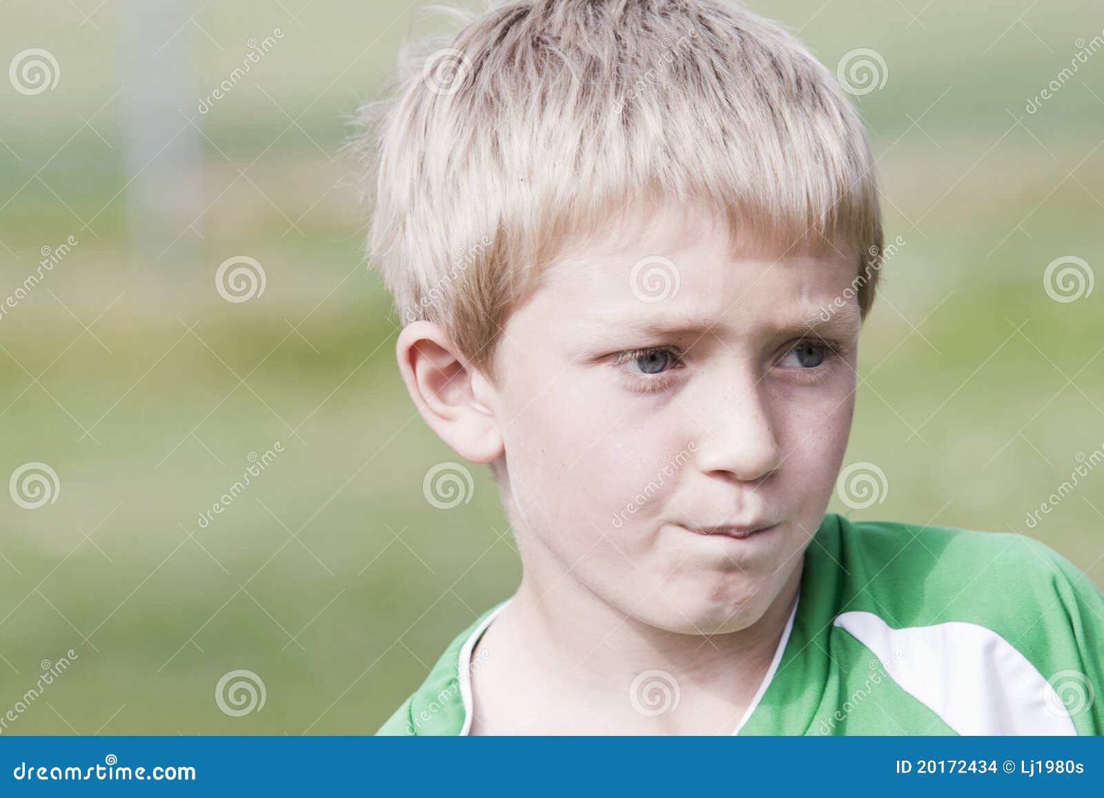 Young Blonde Boy with Pensive Expression Stock Photo - Image of ...