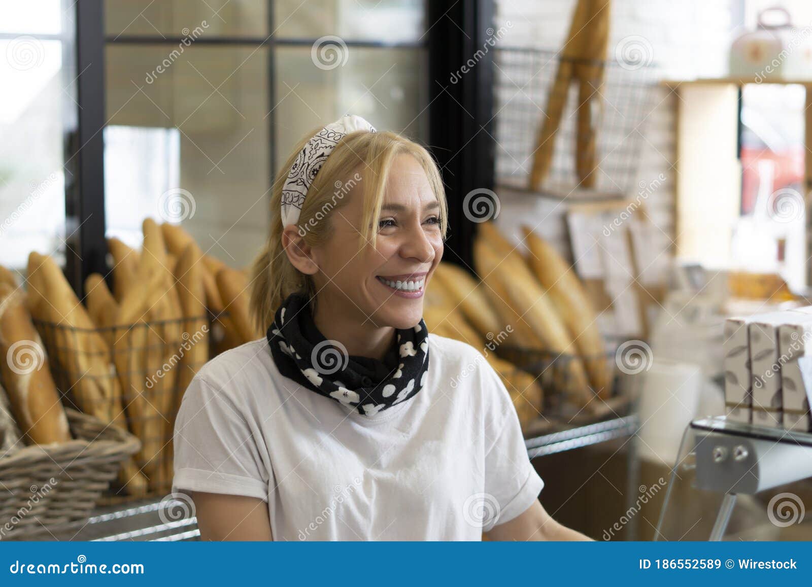 Young Blonde Female Smiling while Working in the Bakery Stock Image ...