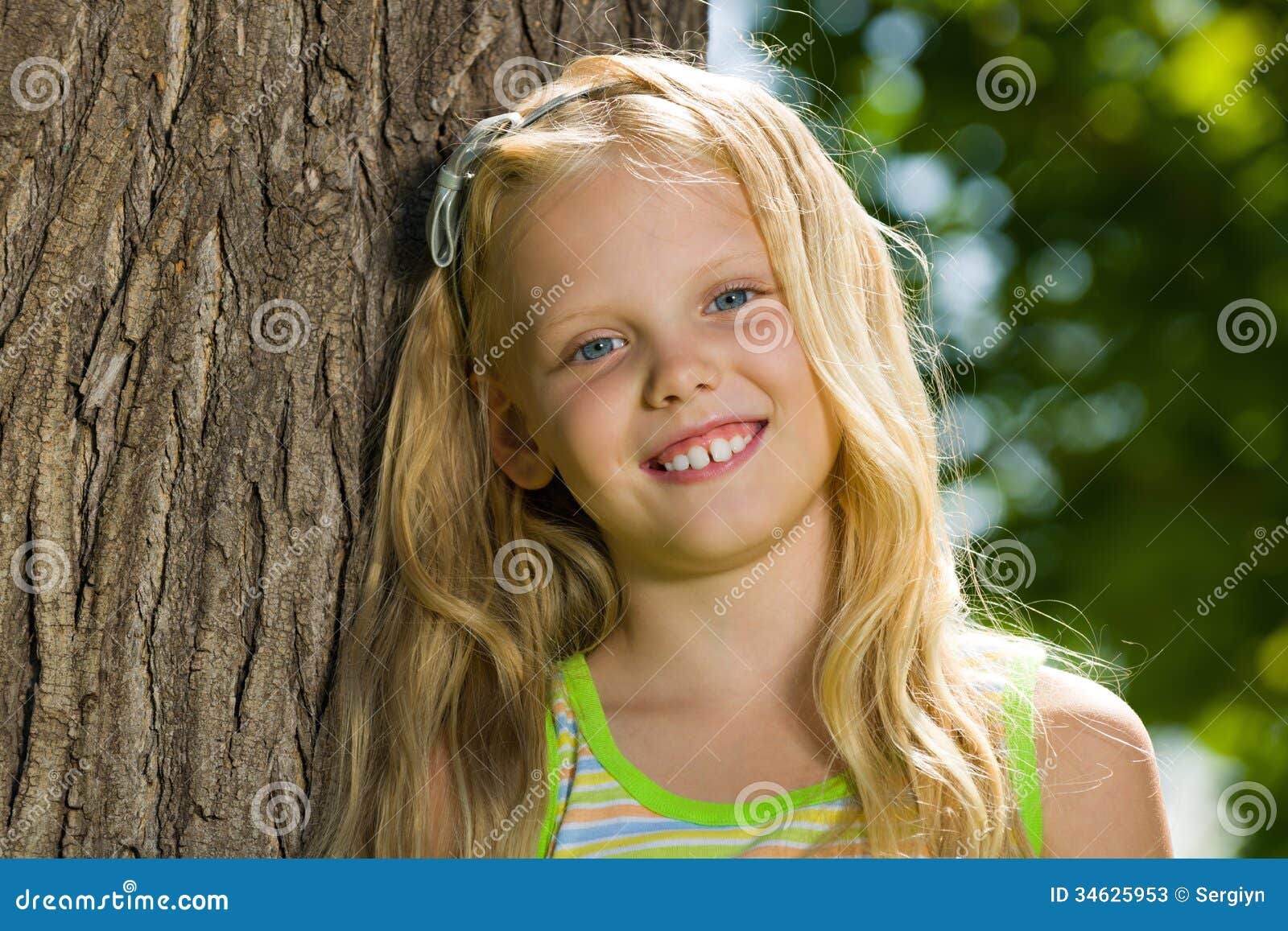 Young Blonde Girl Near a Tree Stock Image - Image of face, people: 34625953