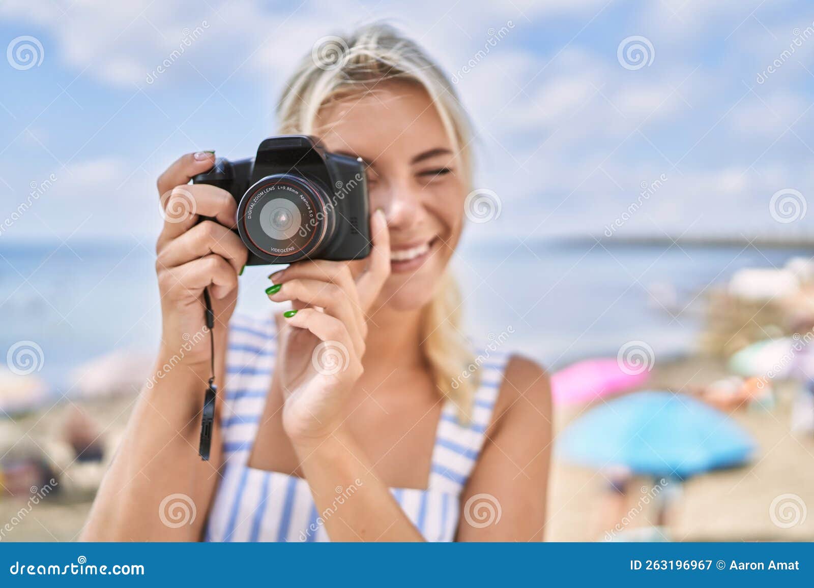 Young Blonde Girl Smiling Happy Using Camera at the Beach Stock Image ...