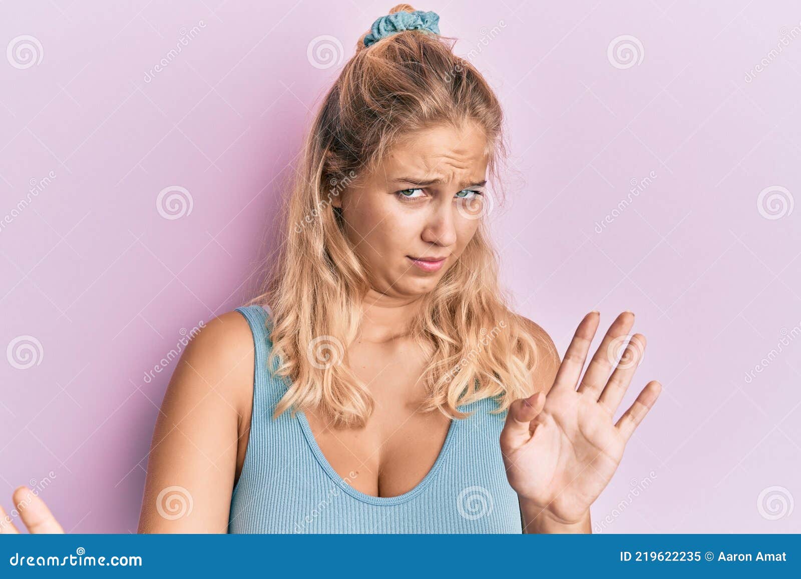Young Blonde Girl Wearing Casual Clothes Afraid And Terrified With Fear