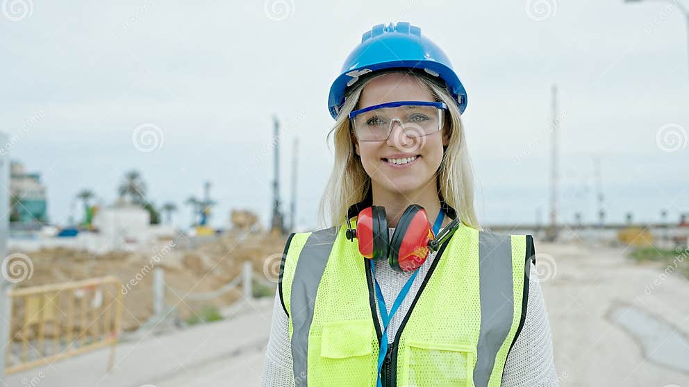 Young Blonde Woman Architect Smiling Confident Standing at Street Stock ... Young Blonde Woman Architect Smiling Confident Standing at Street Stock ...