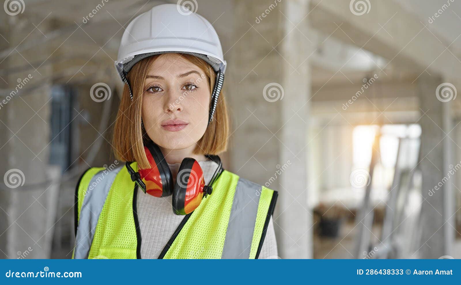 Young Blonde Woman Architect Standing with Relaxed Expression at ...