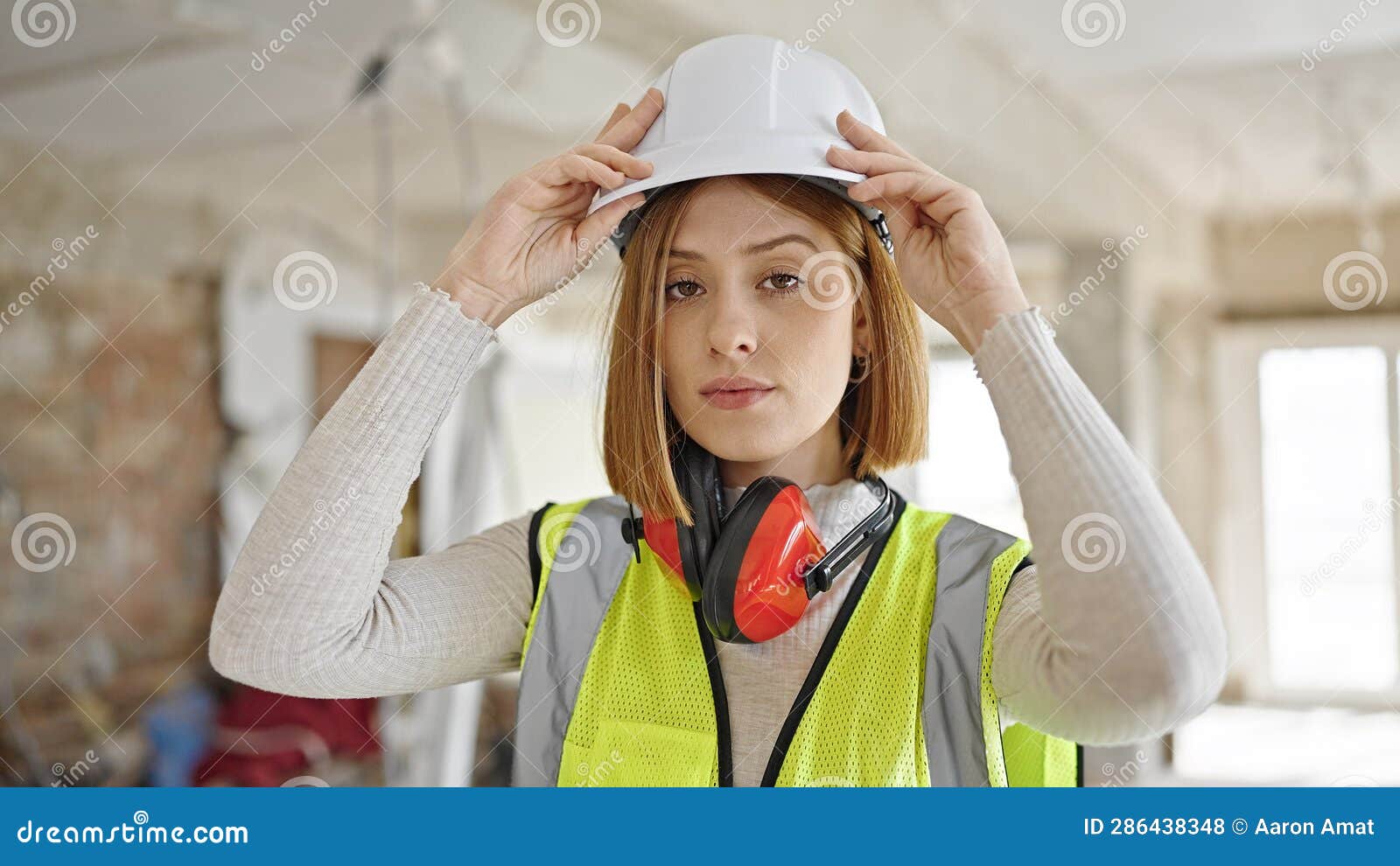 Young Blonde Woman Architect Standing with Relaxed Expression at ...