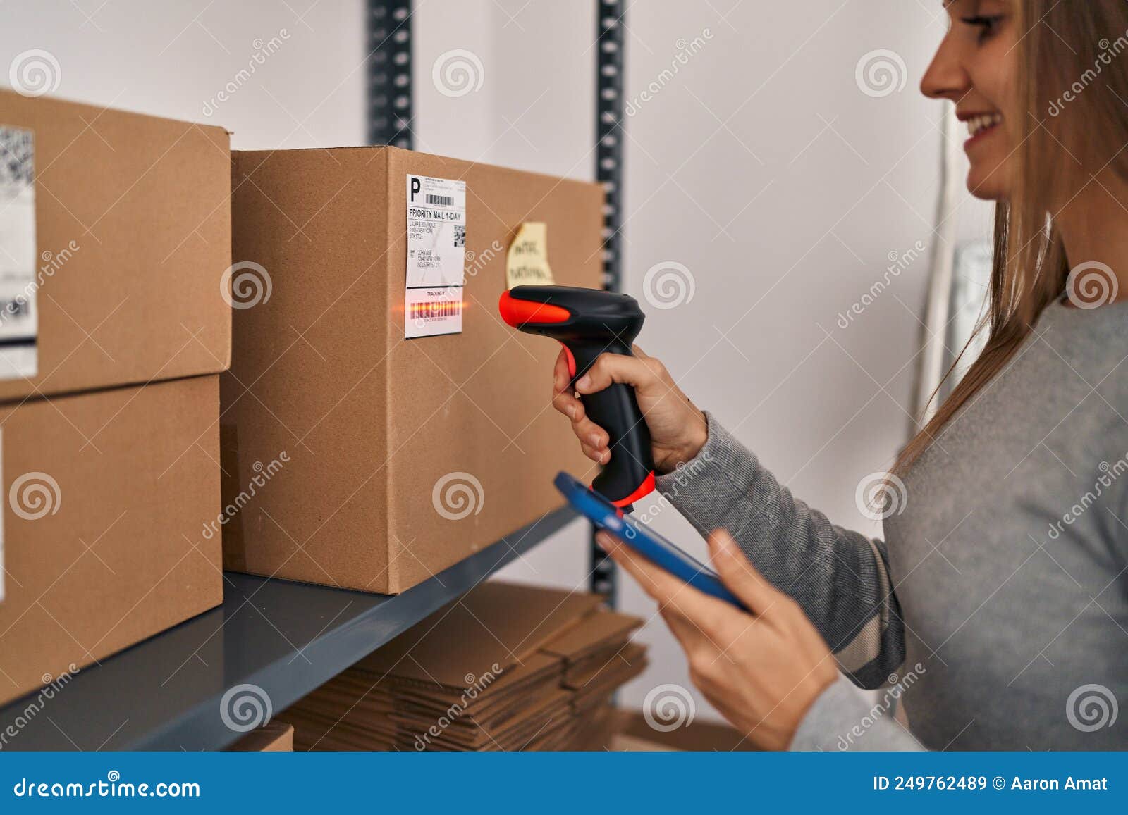 Young Blonde Woman Ecommerce Business Worker Scanning Packages Using ...