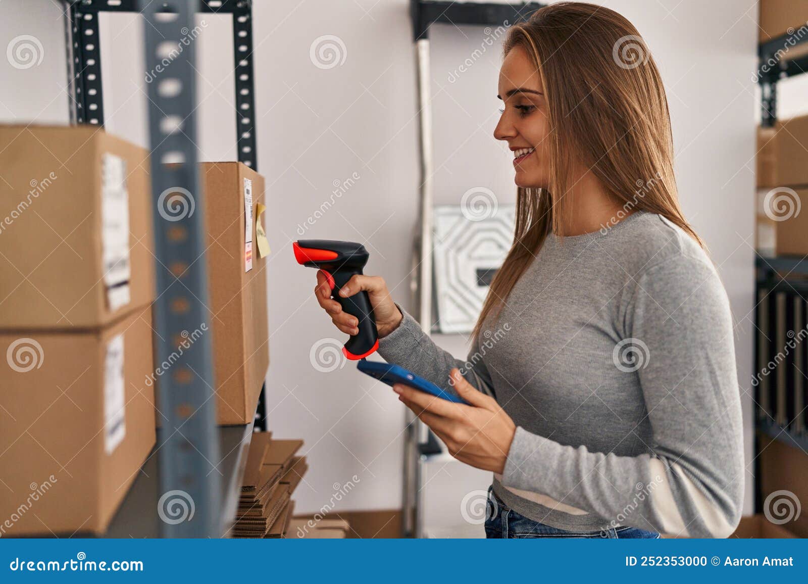 Young Blonde Woman Ecommerce Business Worker Scanning Packages Using ...