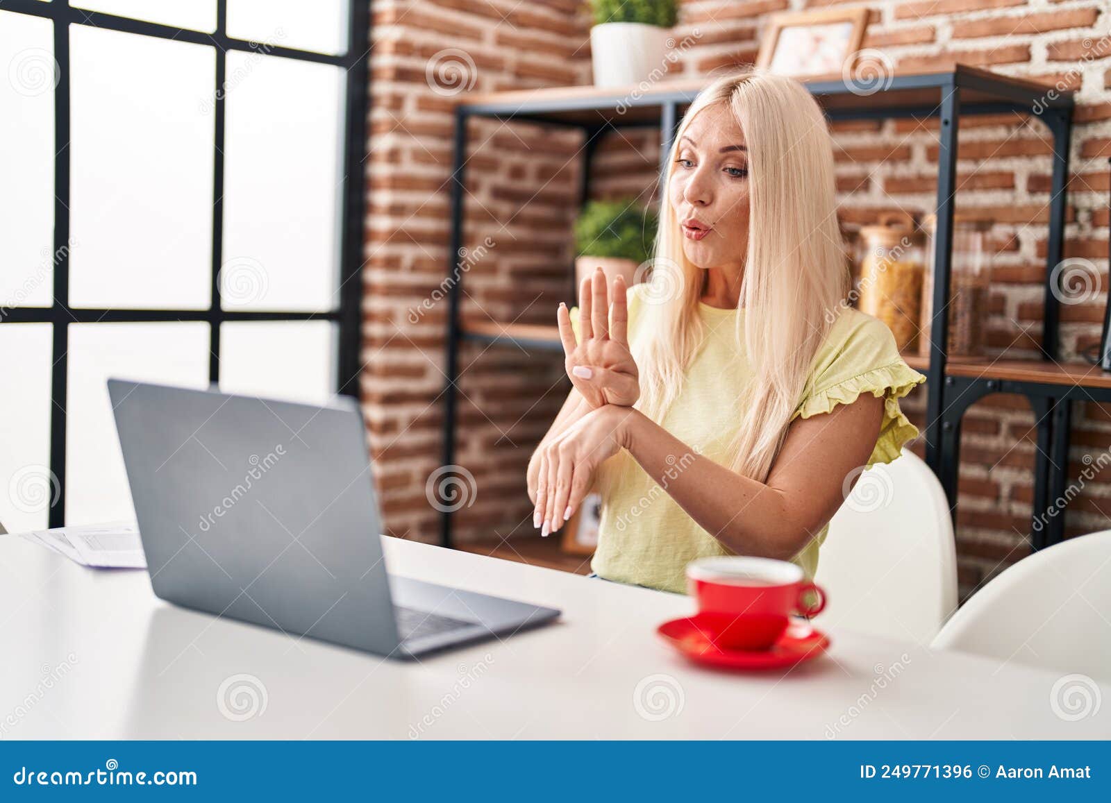 Young Blonde Woman Having Video Call Using Deaf Language at Home Stock ...