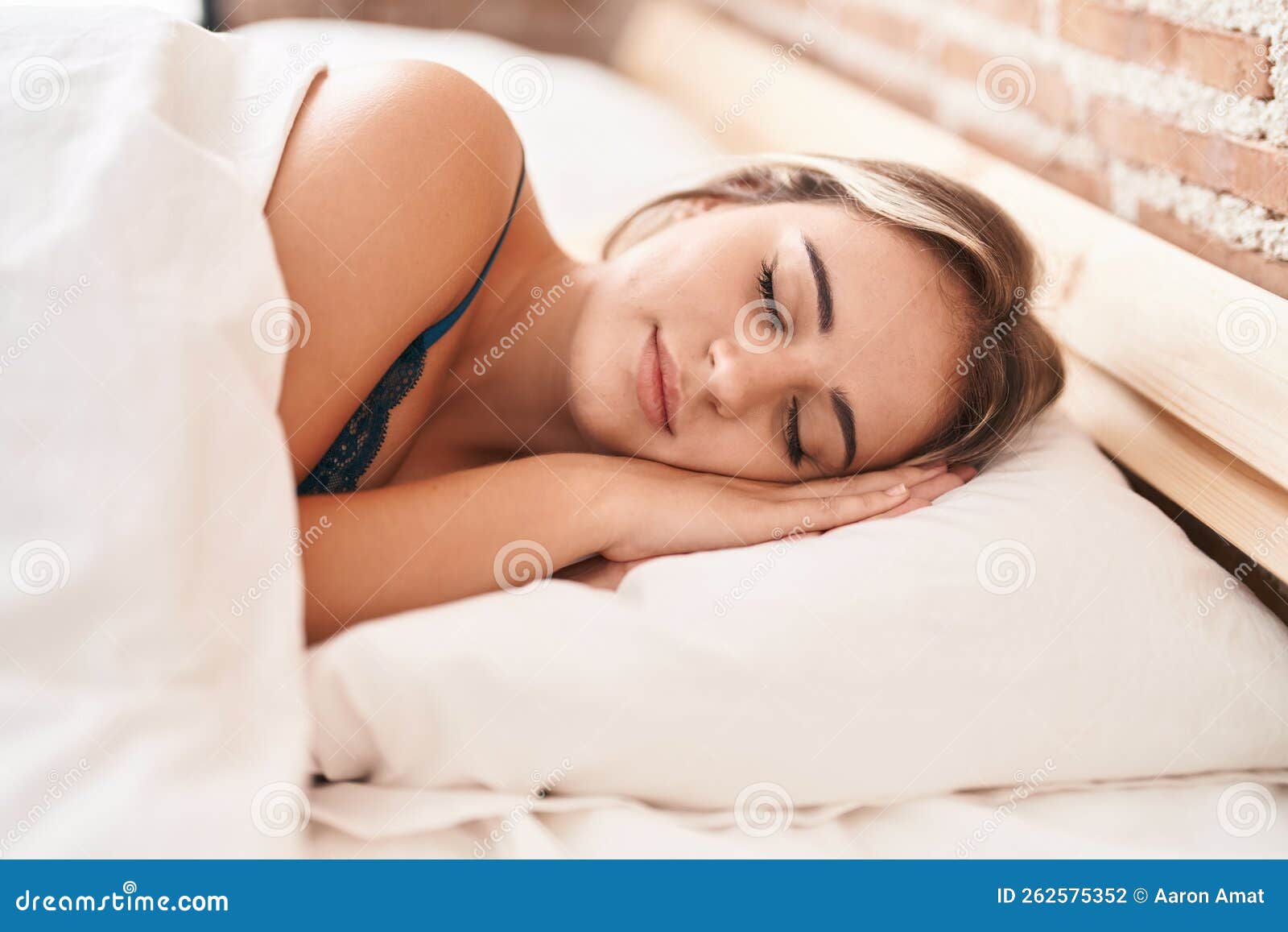 Young Blonde Woman Lying on Bed Sleeping at Bedroom Stock Photo - Image ...