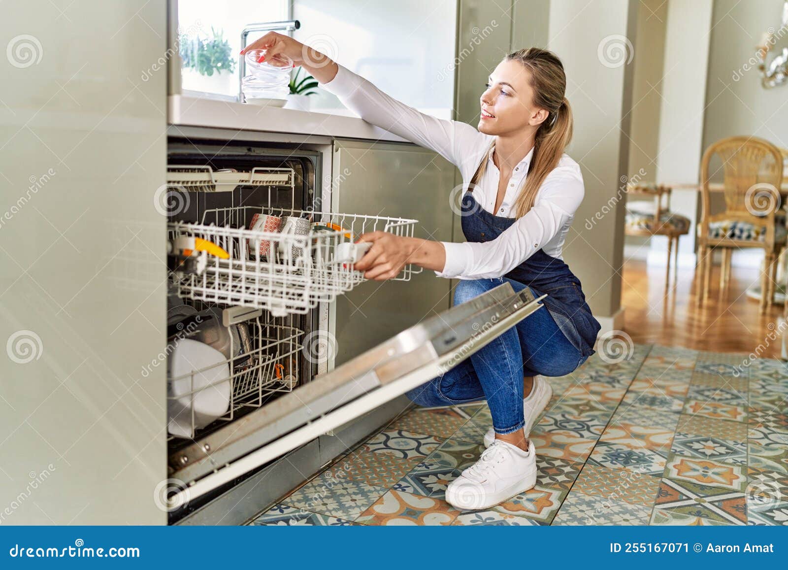 Young Blonde Woman Smiling Confident Using Dishwasher at Kitchen Stock ...