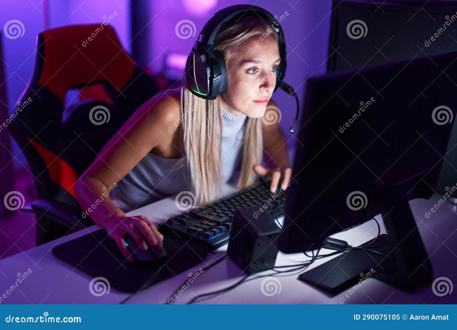 Young Blonde Woman Streamer Playing Video Game Using Computer at Gaming ...
