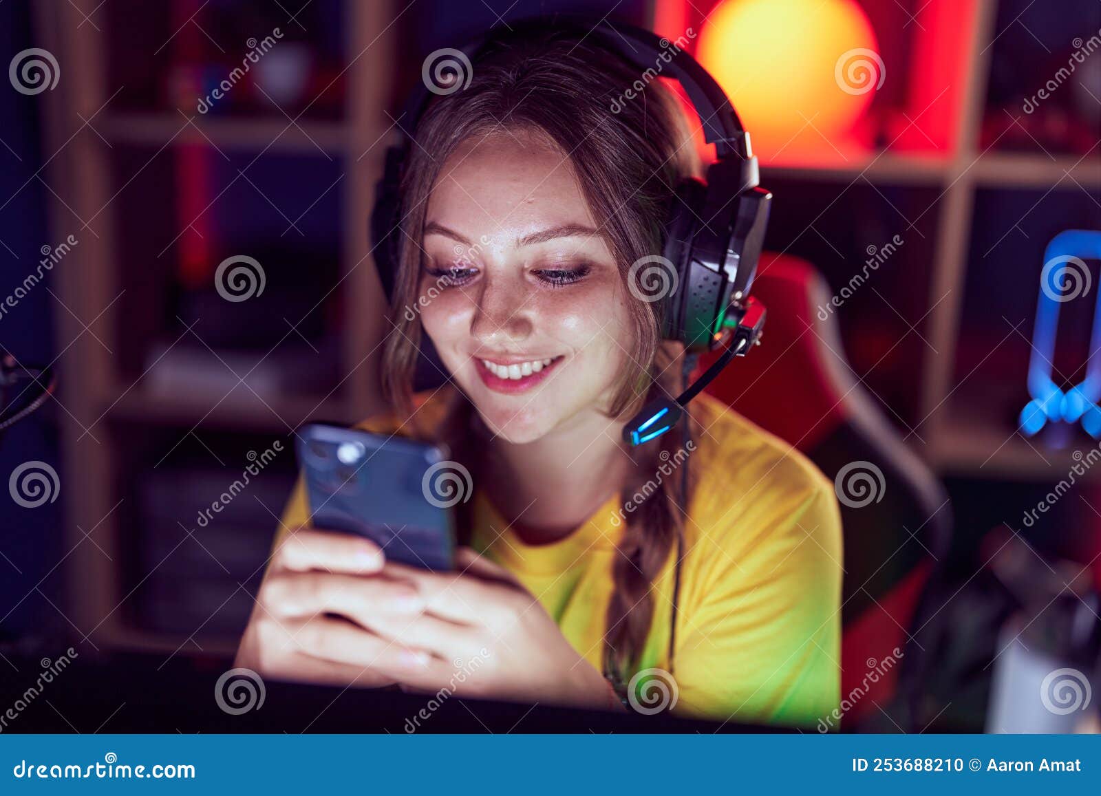 Young Blonde Woman Streamer Using Computer and Smartphone at Gaming ...