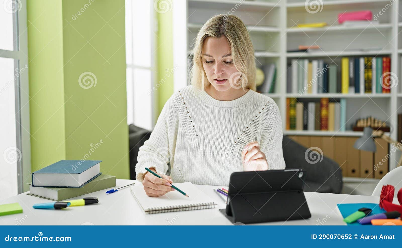 Young Blonde Woman Student Drawing on Notebook Using Touchpad at ...