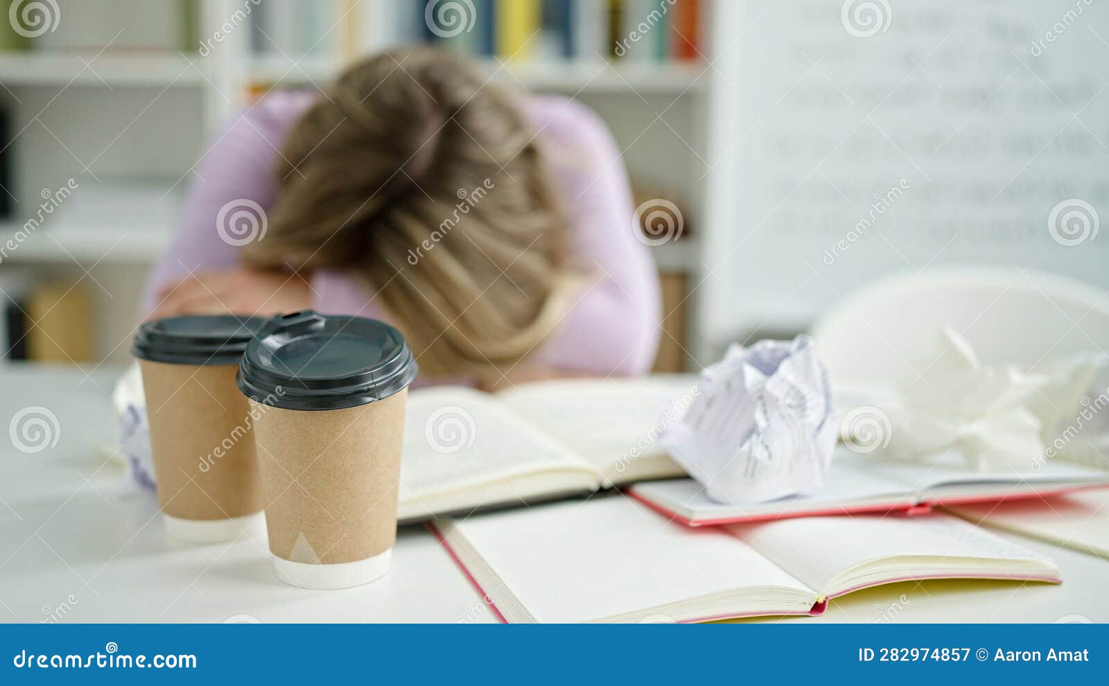 Young Blonde Woman Student Sleeping on Table at Classroom Stock Image ...