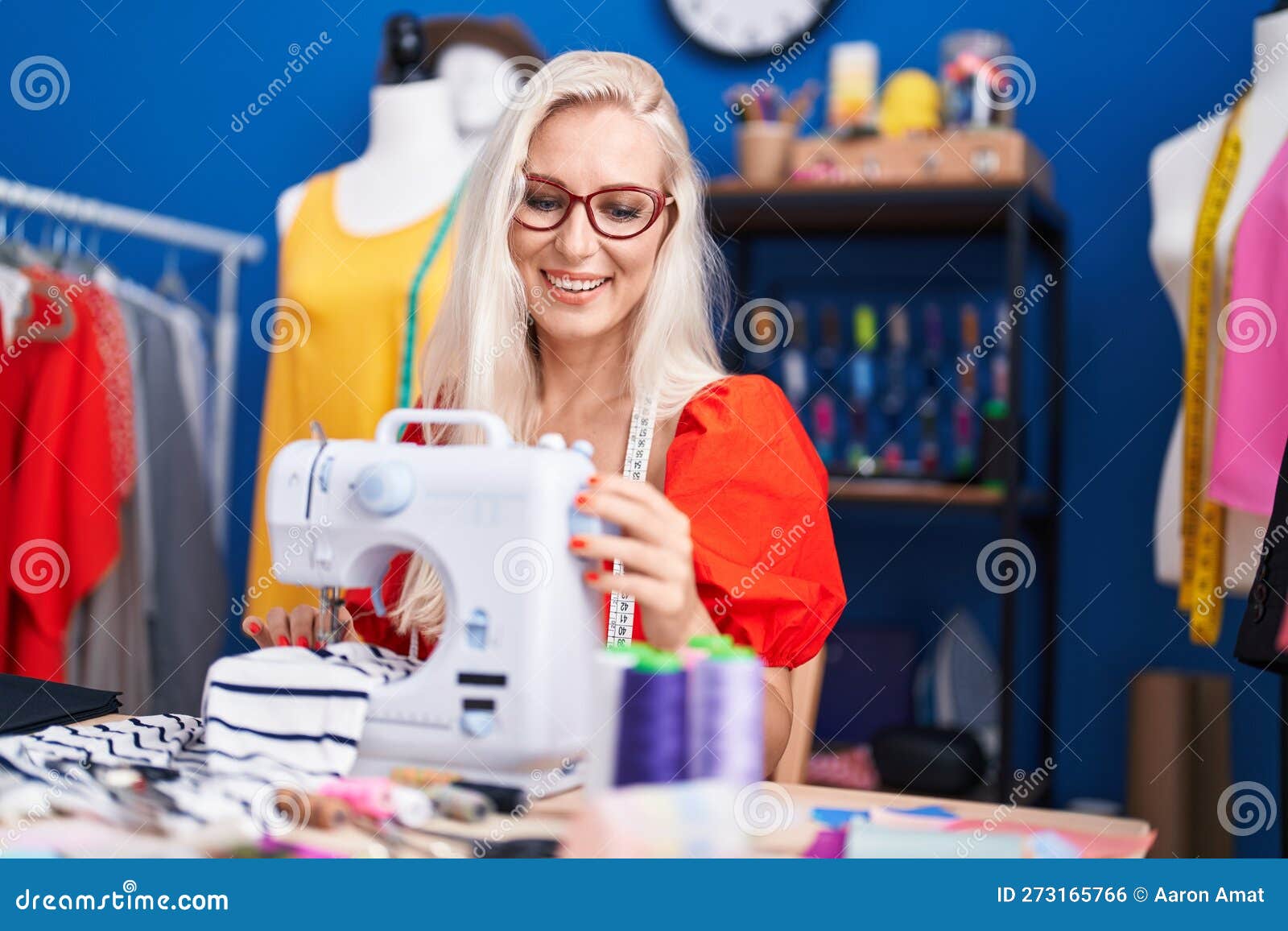 Young Blonde Woman Tailor Smiling Confident Using Sewing Machine at ...