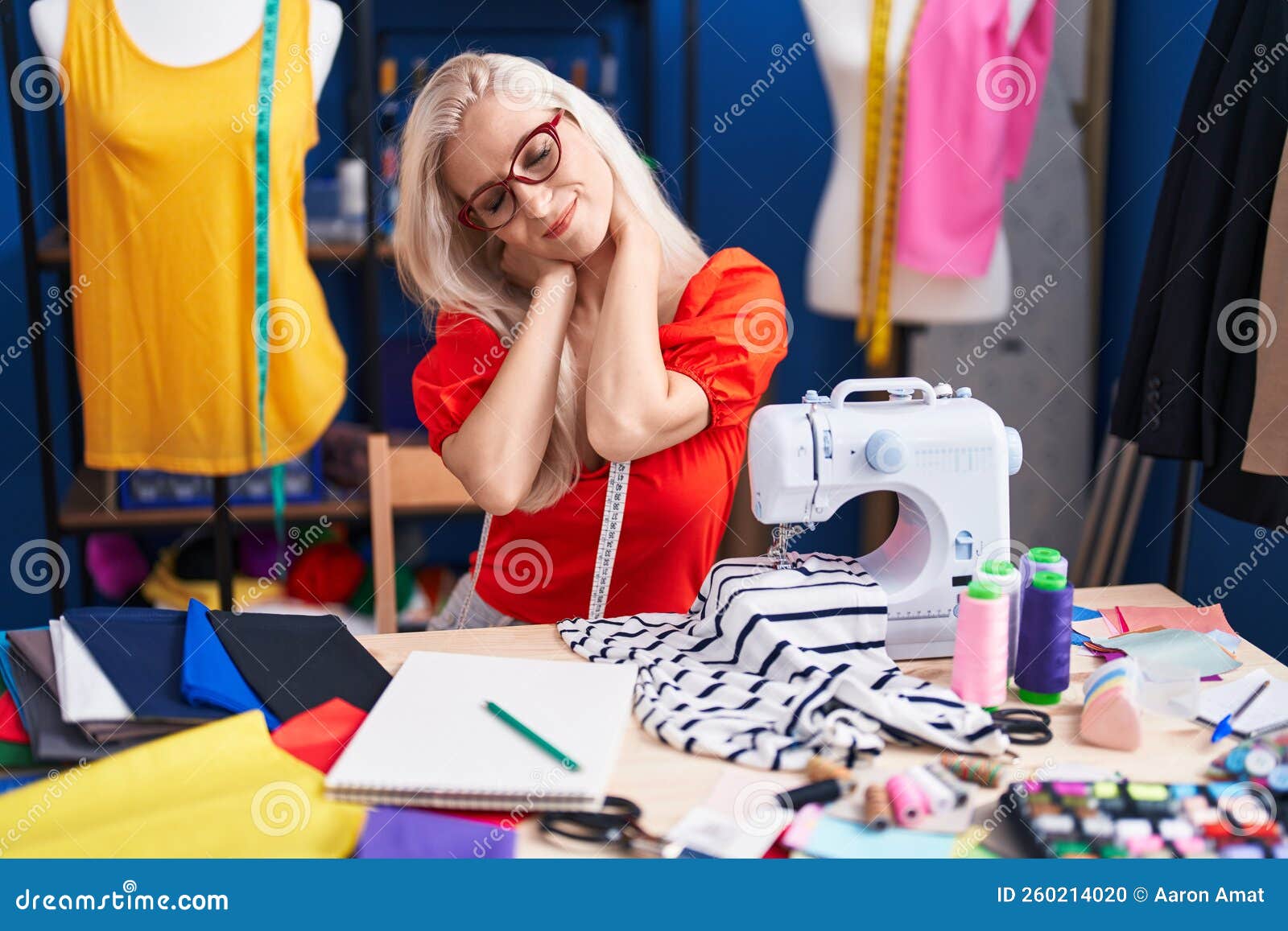 Young Blonde Woman Tailor Stressed Using Sewing Machine at Sewing ...