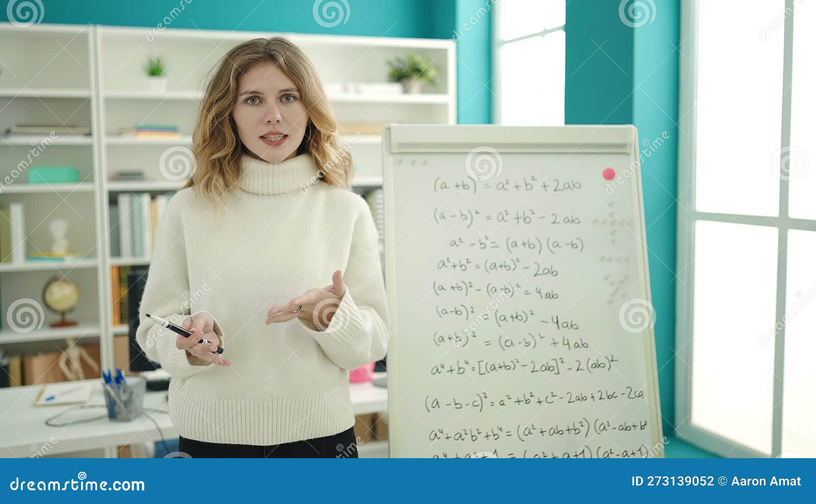 Young Blonde Woman Teacher Explaining Maths Exercise at University ...
