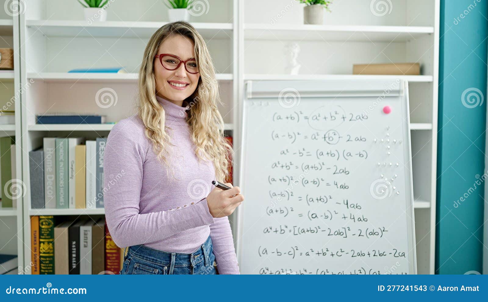 Young Blonde Woman Teacher Teaching Maths Lesson at Classroom Stock ...