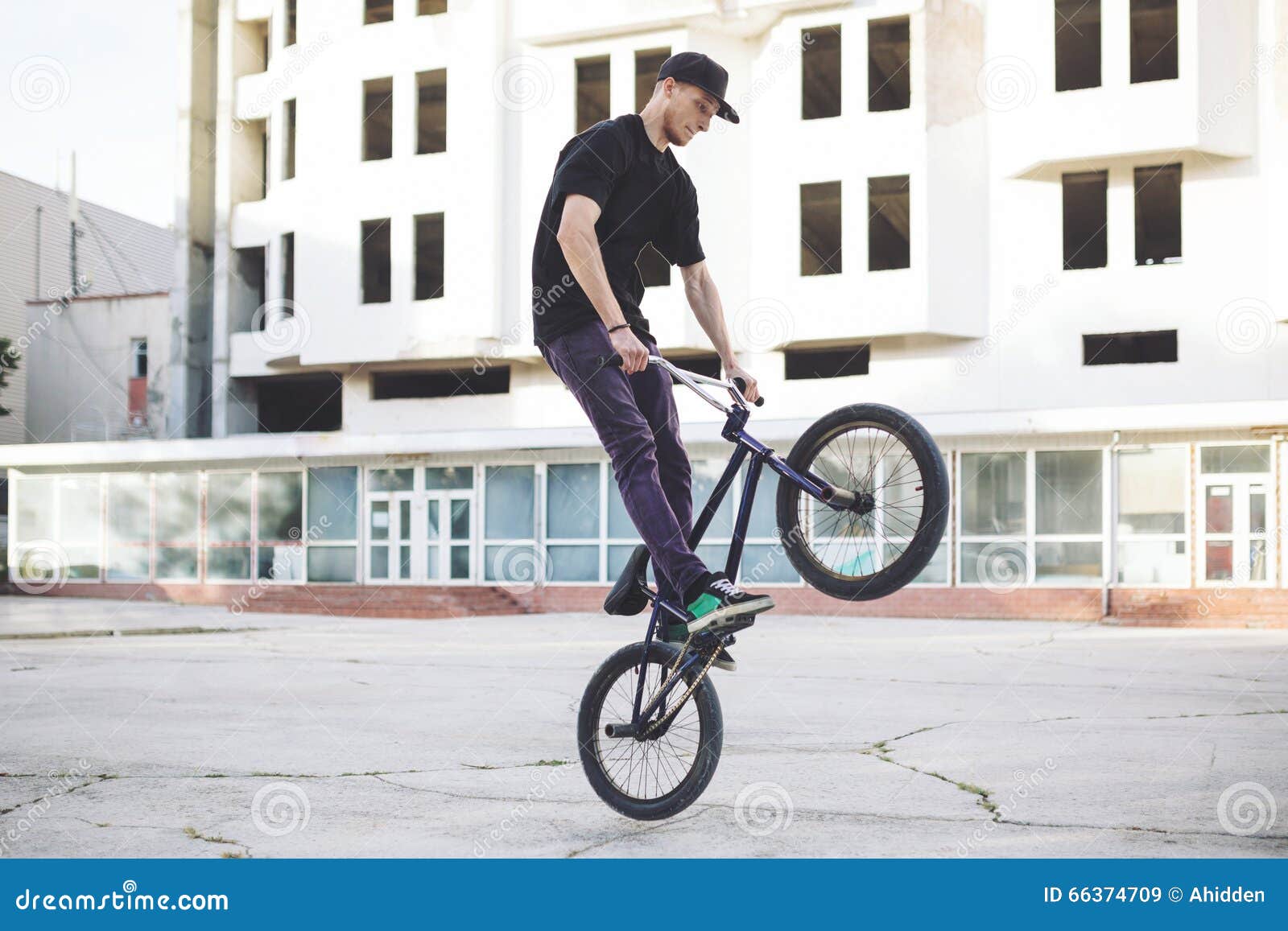 Young BMX bicycle rider stock image. Image of pedals - 66374709