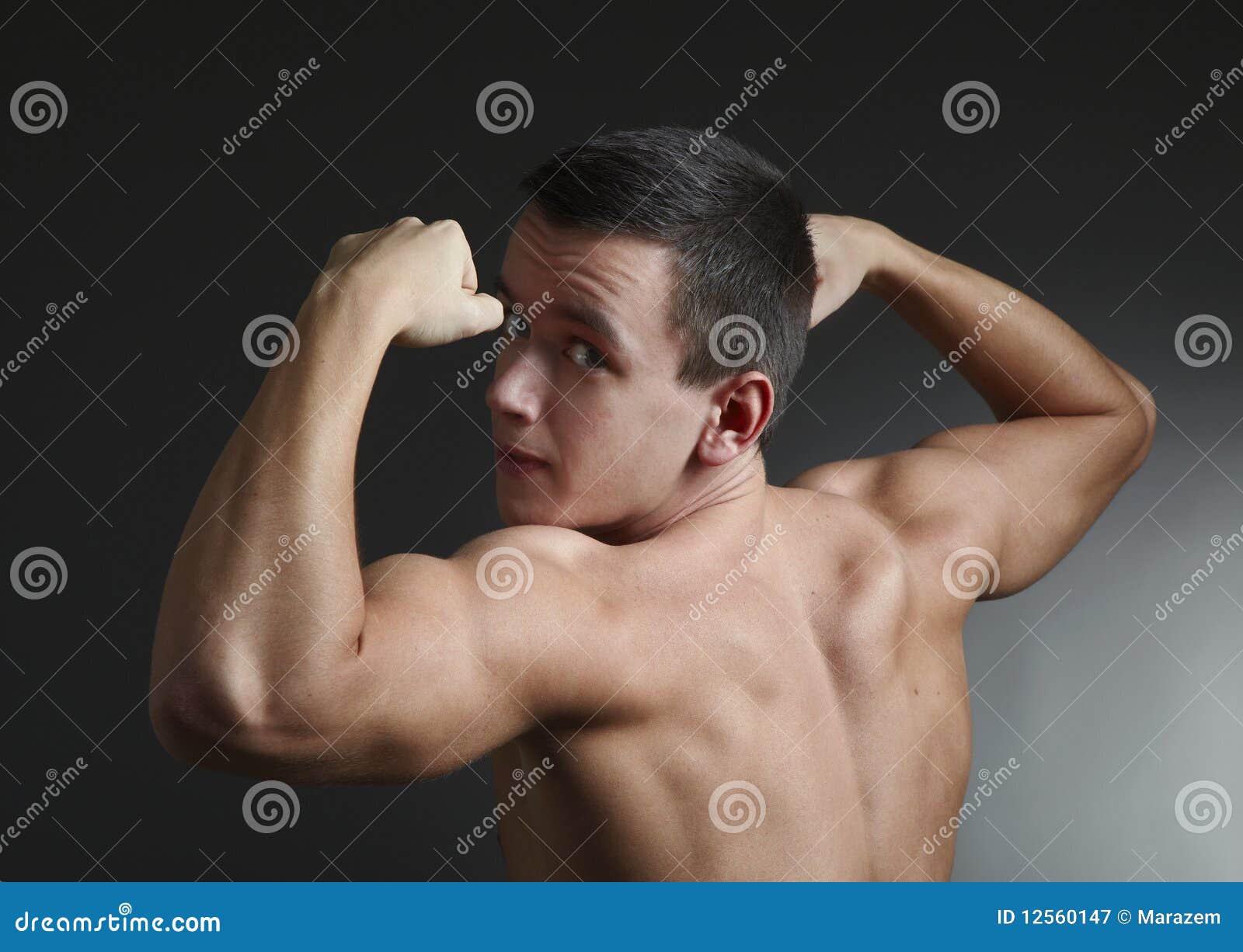 Young Bodybuilder Flexing Muscles Royalty-Free Stock Photo ...