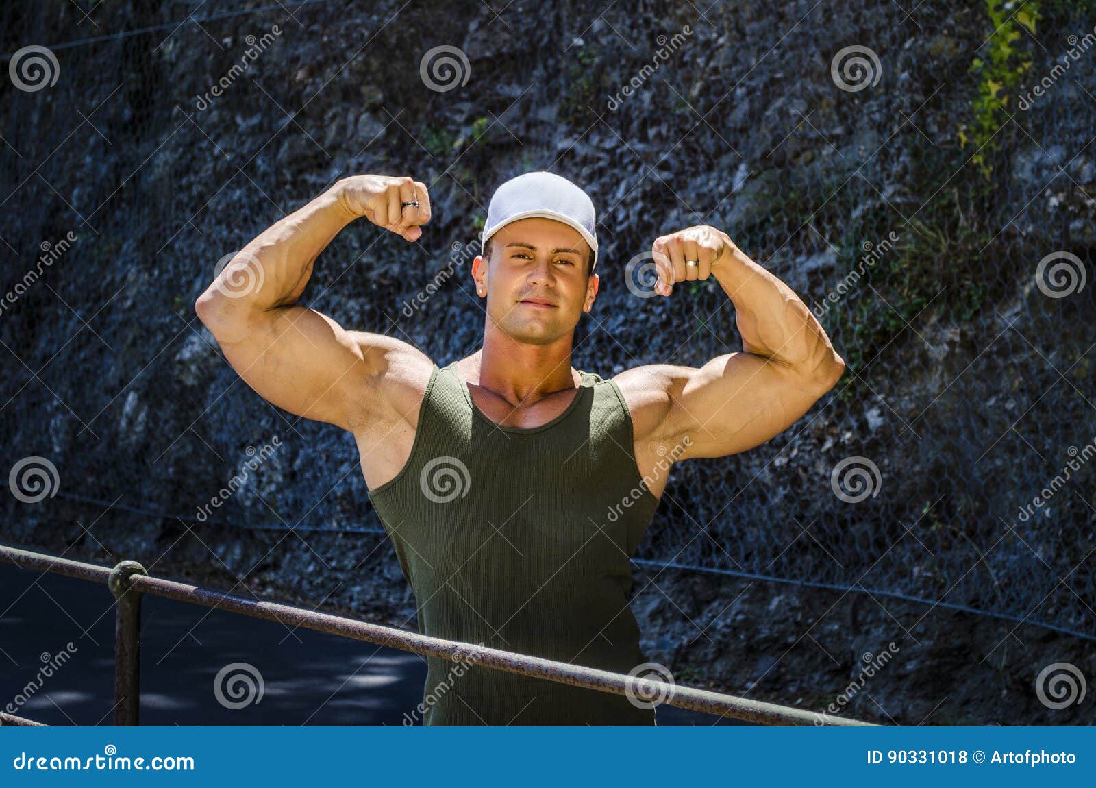 Young Bodybuilder Doing Double Biceps Pose Stock Photo - Image of wide ...