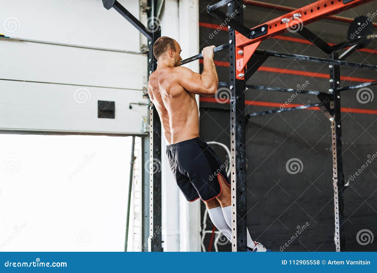 Young Bodybuilder Doing Pull-ups Stock Photo - Image of active ...
