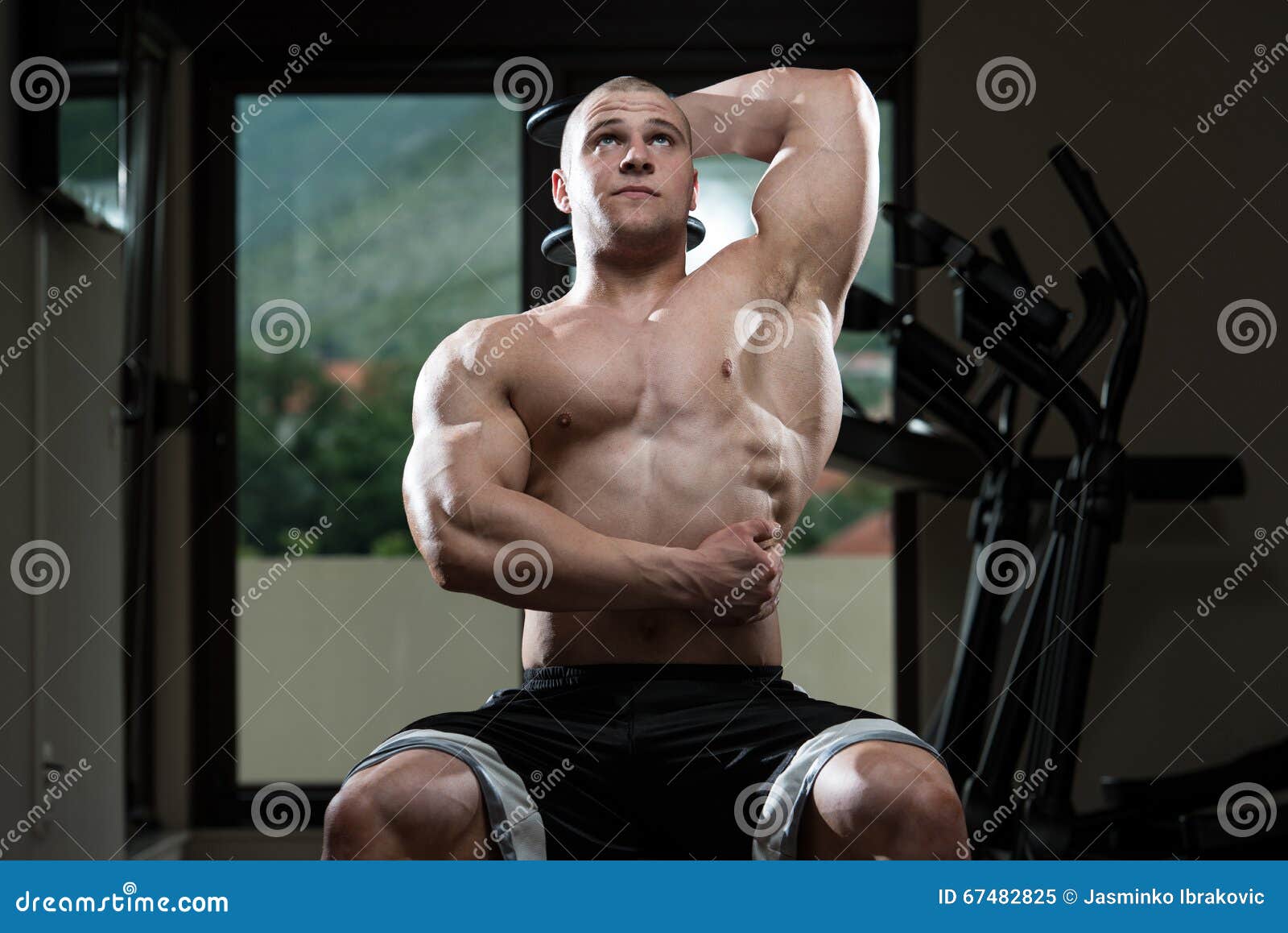 Young Bodybuilder Exercise Triceps with Dumbbell Stock Image - Image of ...