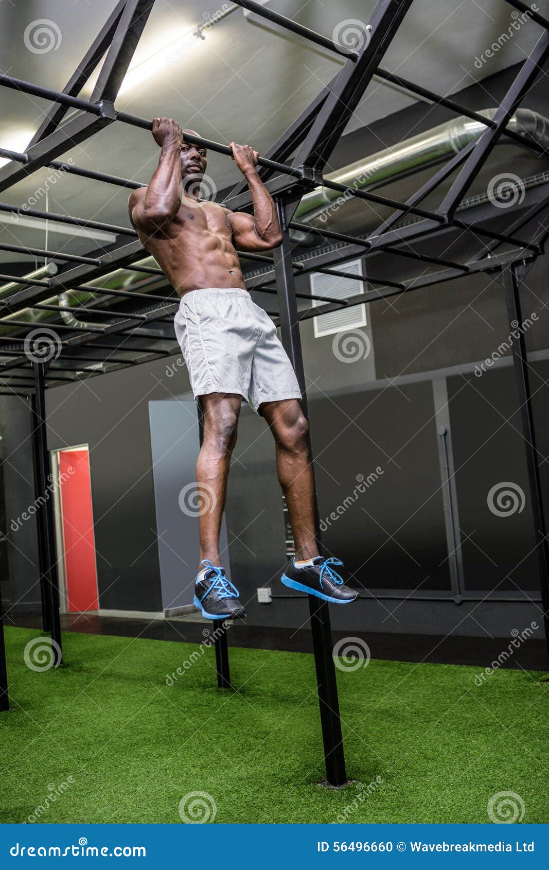 Young Bodybuilder Lifting Himself Up and Down Stock Photo - Image of ...