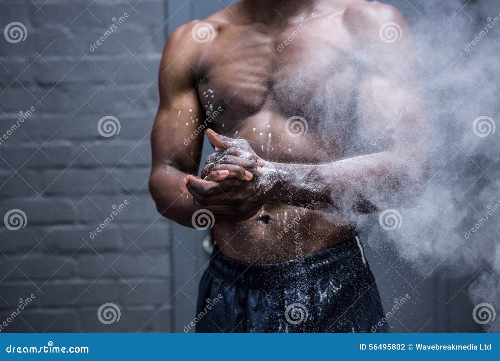 Young Bodybuilder Shaking Chalk Off His Hands Stock Photo - Image of ...