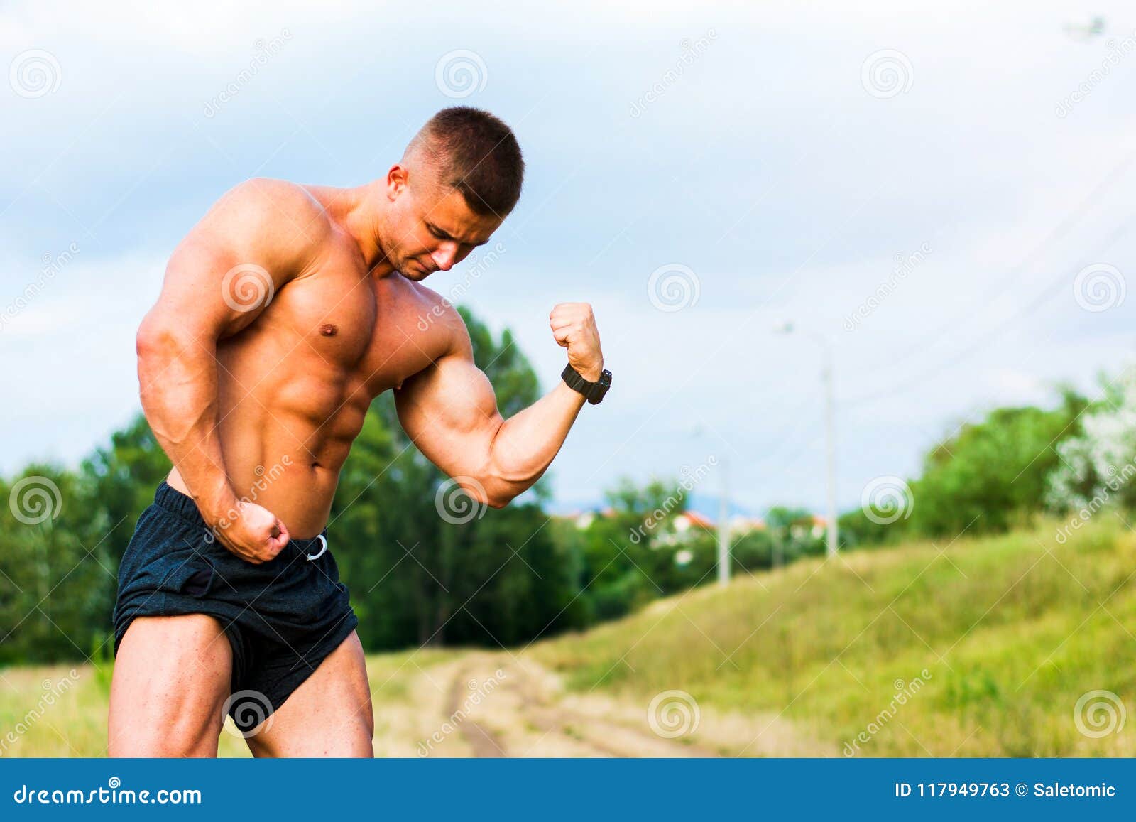 Young Bodybuilder Showing Muscles Shape Stock Image - Image of ...