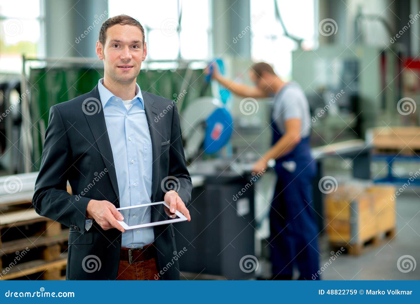 Young boss in his factory stock image. Image of plant - 48822759