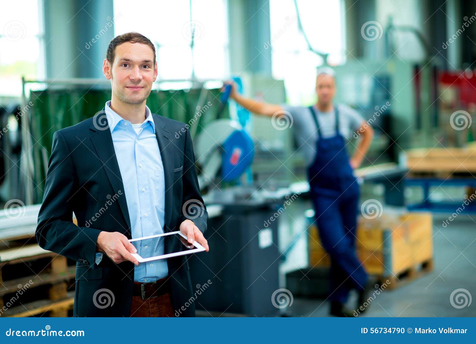 Young boss in his factory stock photo. Image of control - 56734790