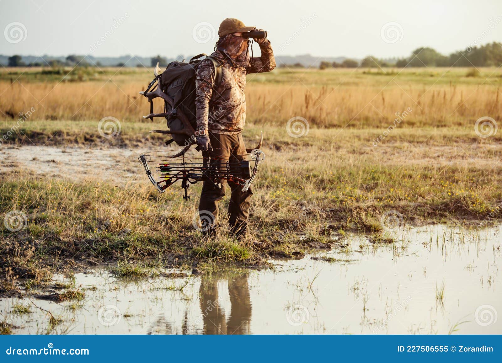 Bow Hunter Tracking Prey. Modern Bow Hunter Stock Image - Image of ...