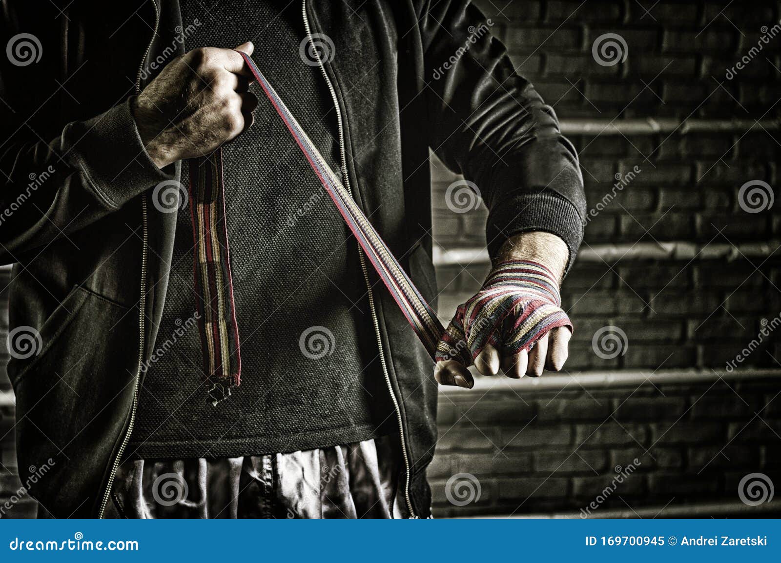 Young Boxer Preparing for Fight, Wrapping Hands with Bandage, Copy ...