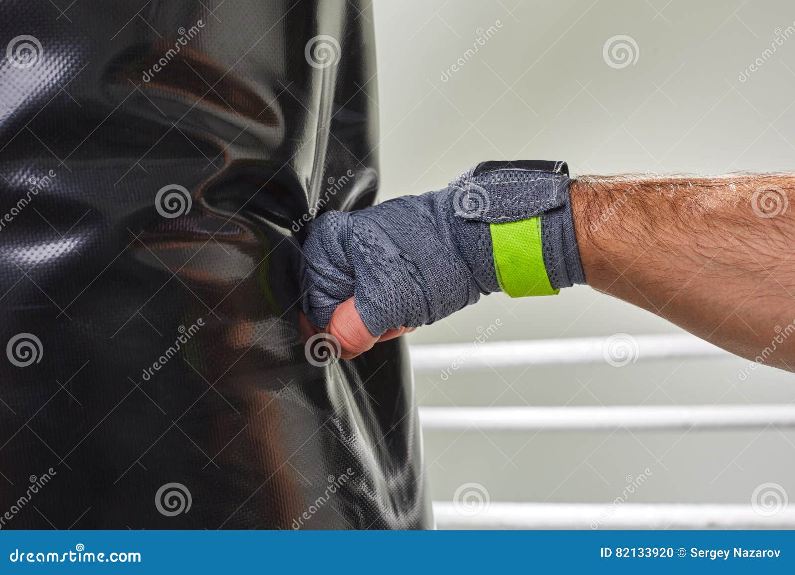 Young Boxer Training His Skills Hitting a Punching Bag. Stock Photo ...