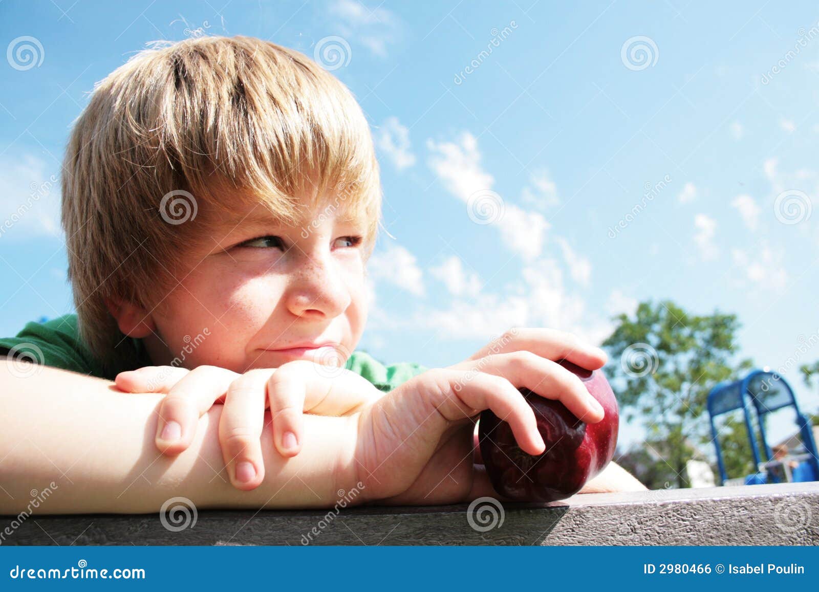 Young boy with an apple stock photo. Image of glance, watching - 2980466