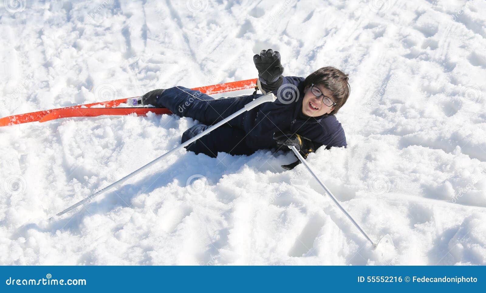 Young Boy Asks for Help after the Fall from Snow Skiing Stock Photo ...