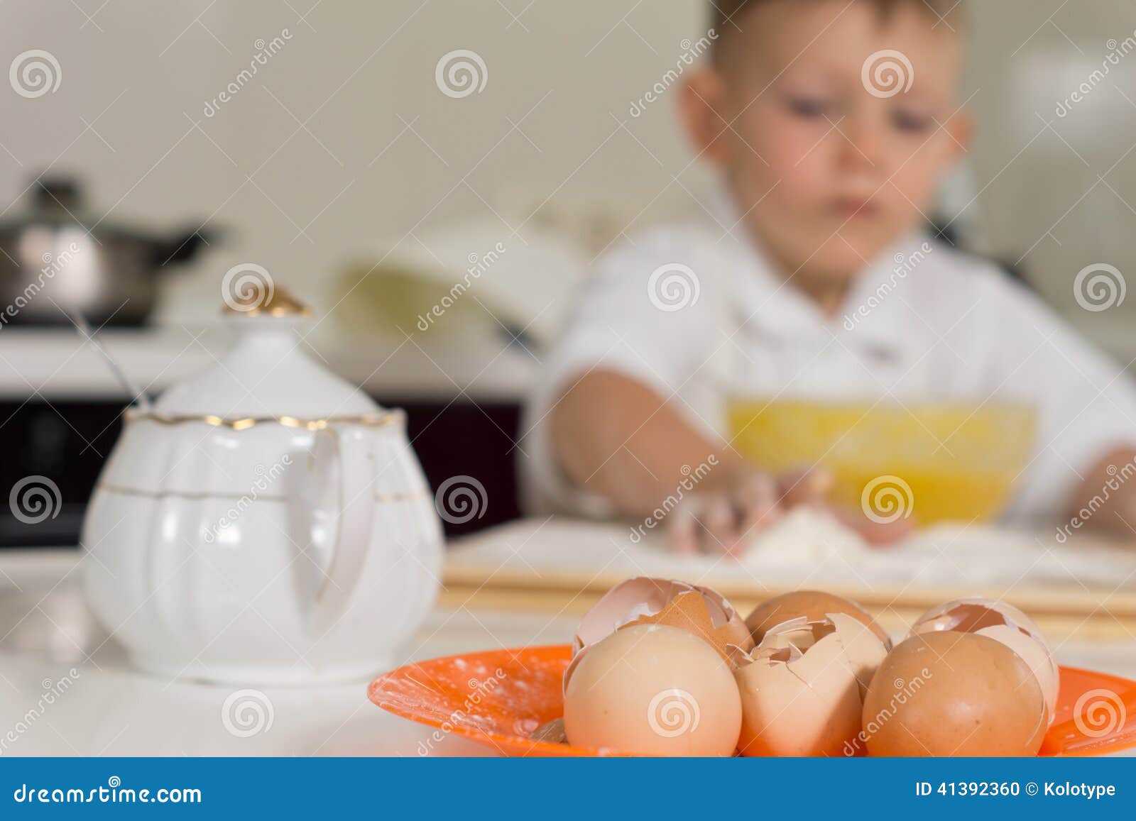 Young Boy Baking in the Kitchen Using Eggs Stock Photo - Image of ...