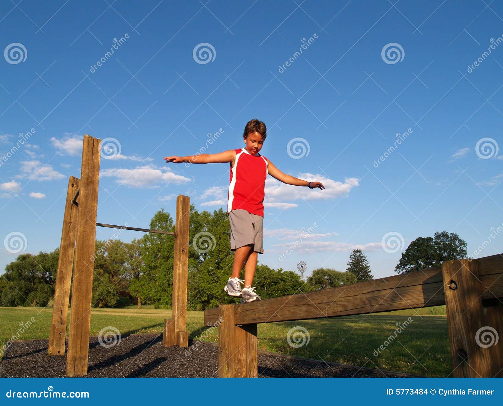 Young Boy on a Balance Beam Stock Photo - Image of balance, activity ...