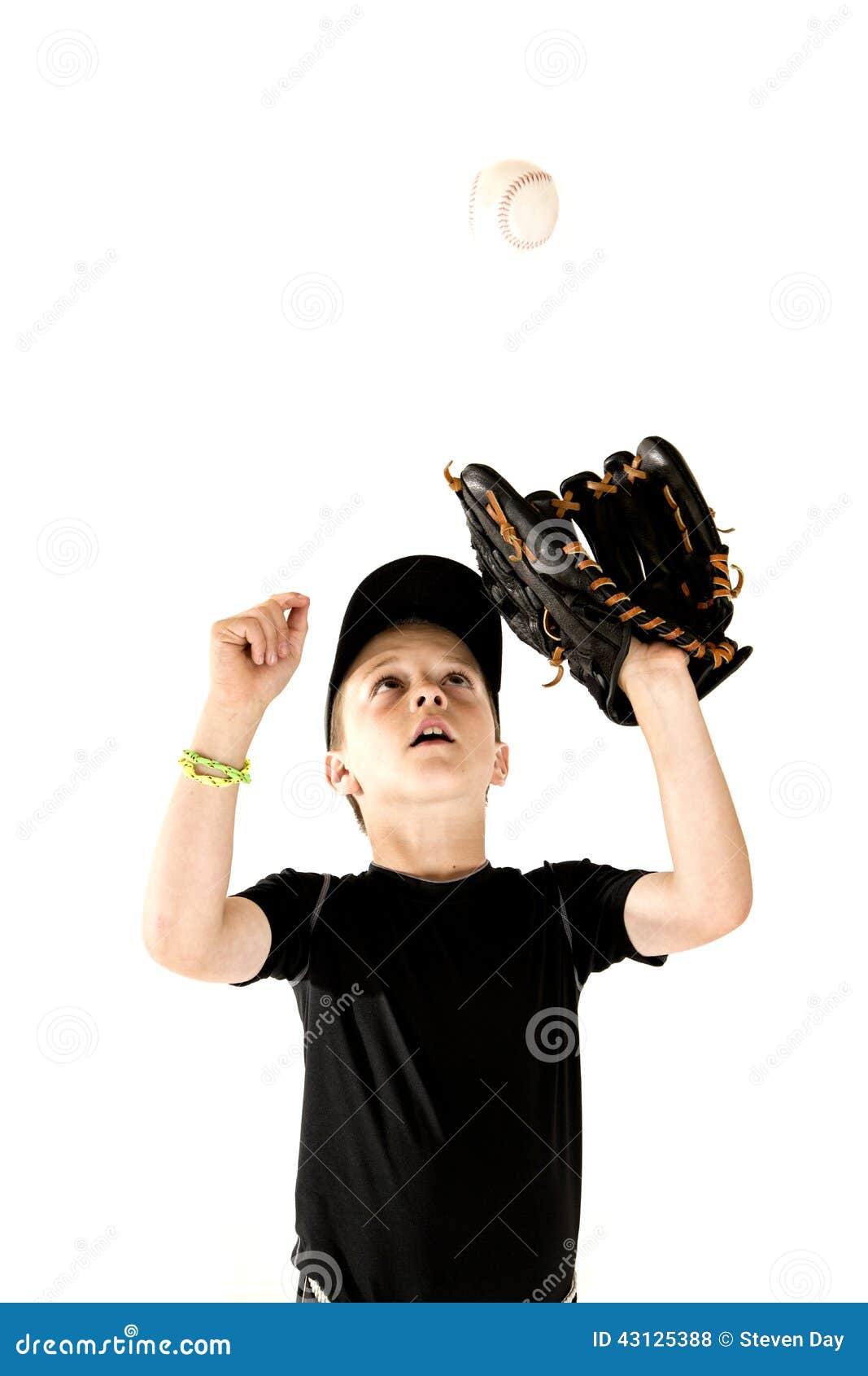 Young Boy Baseball Player Focusing on Catching the Ball Stock Photo ...