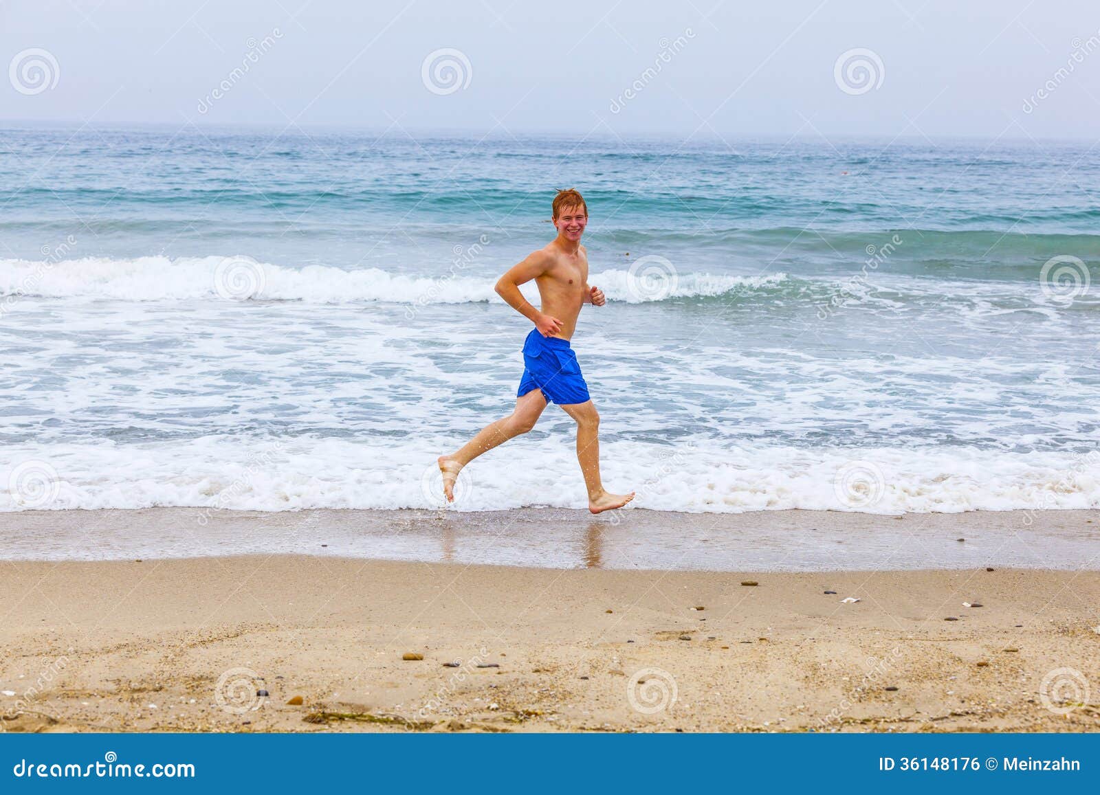 Young boy at the beach stock photo. Image of handsome - 36148176