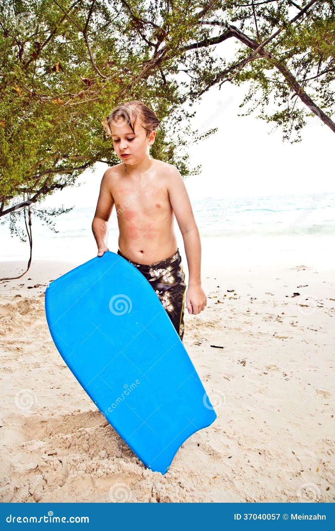 Young Boy at the Beach with Surf Stock Image - Image of asia, feeling ...